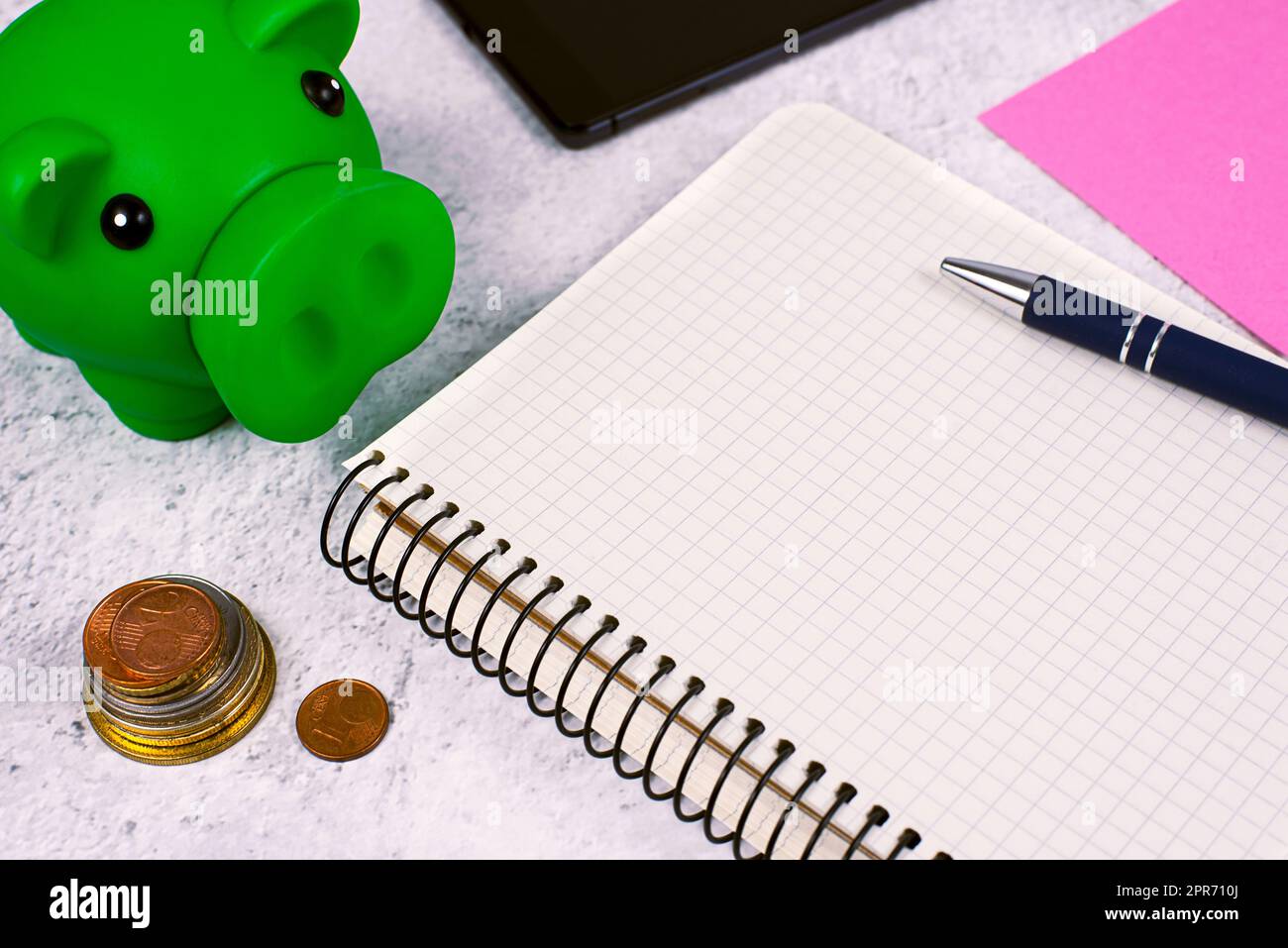 Important Message On Notebook On Desk With Money, Mobile Phone, Pen And ...