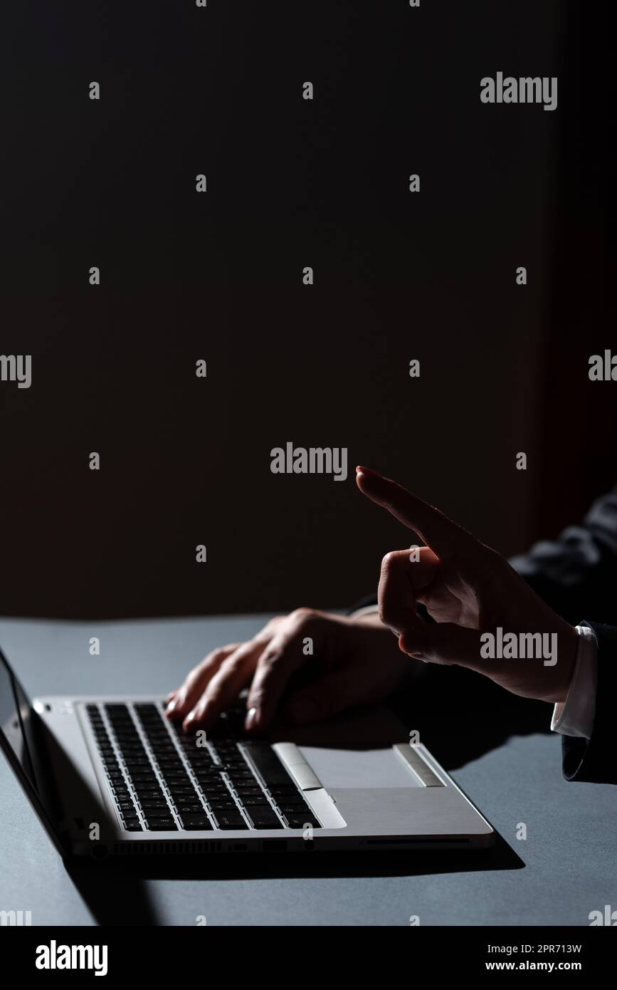 Man Typing On Lap Top And Woman Pointing With One Finger On Important ...