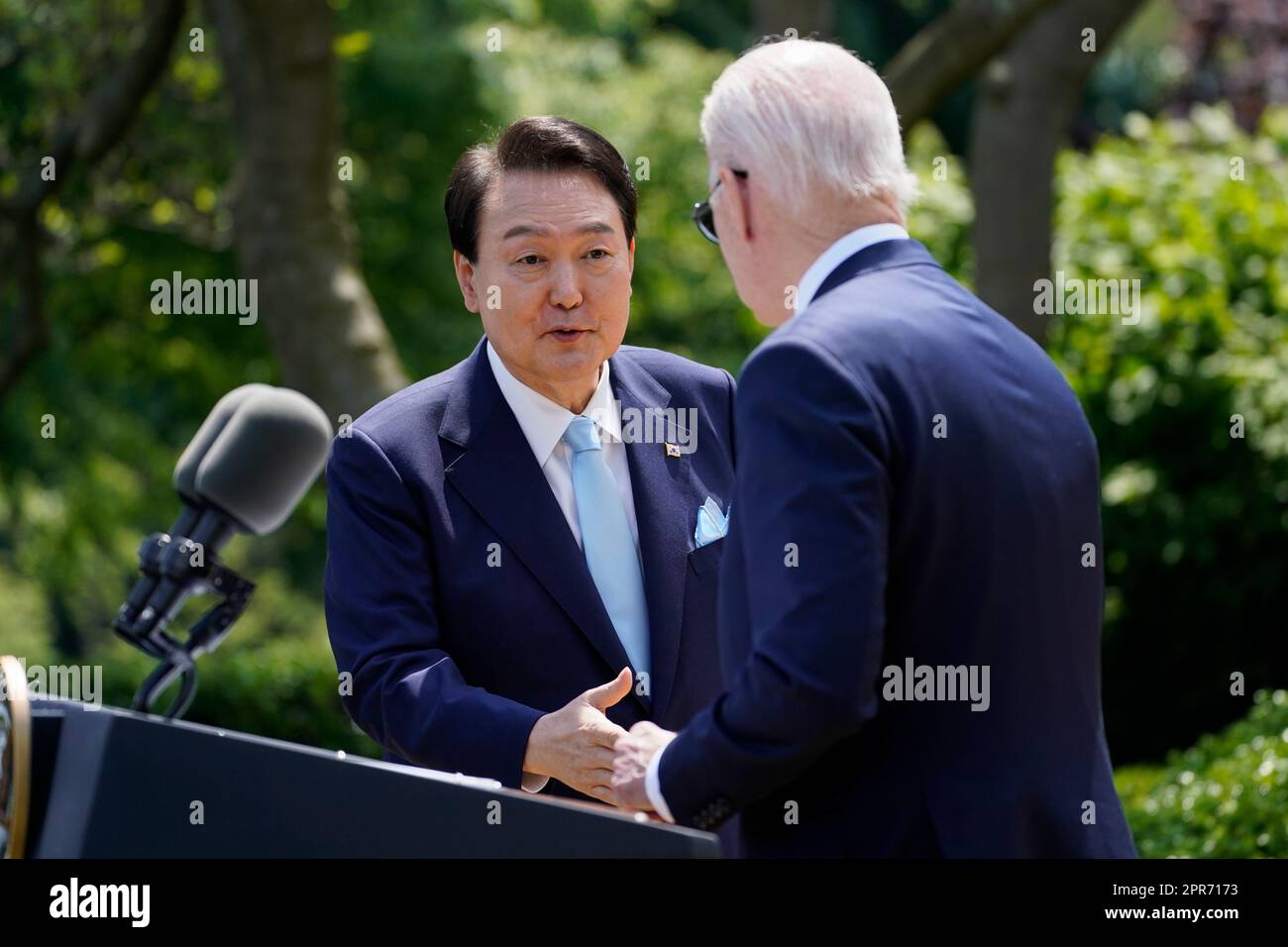 South Korea's President Yoon Suk Yeol shakes hands with President Joe ...