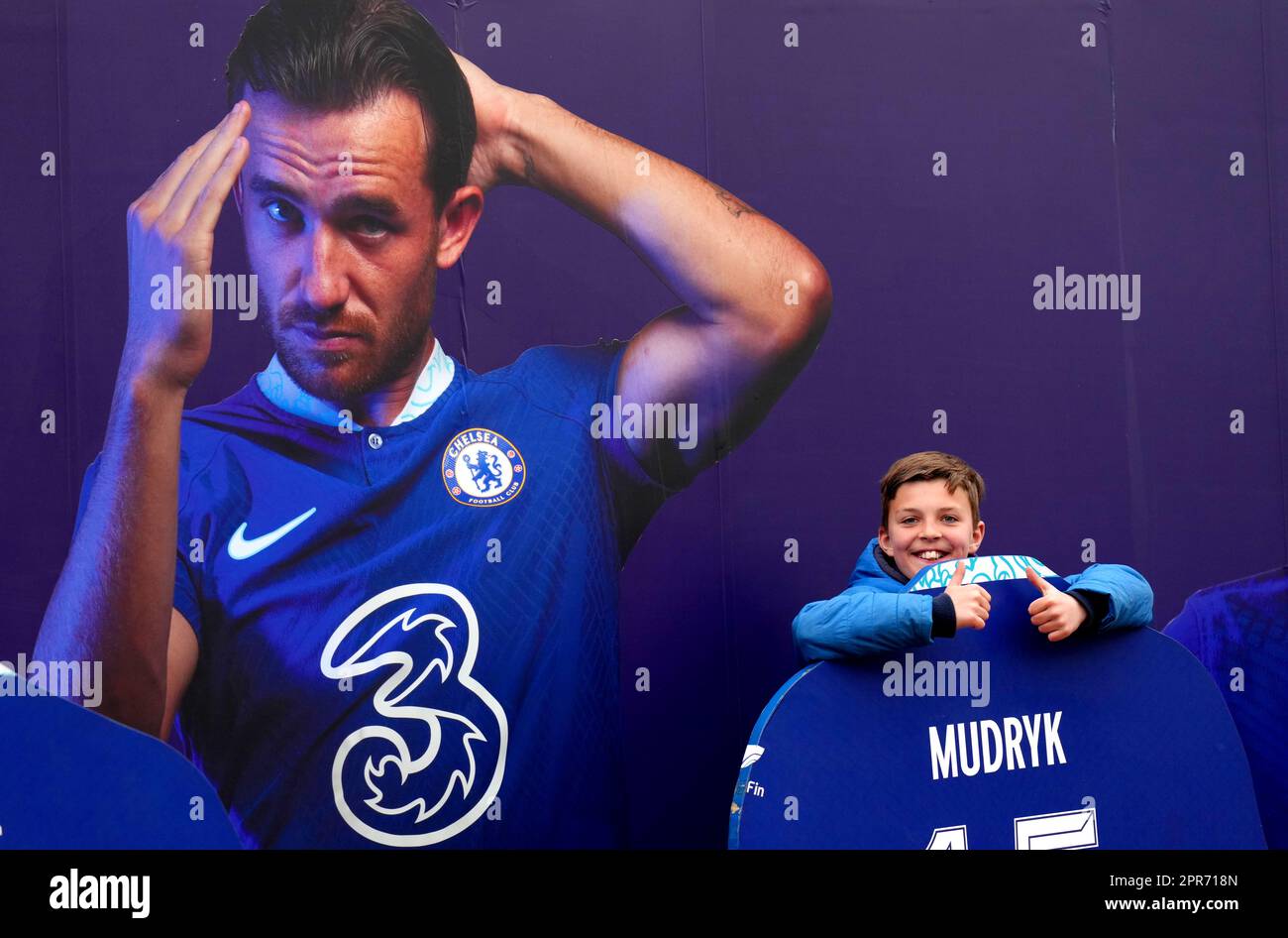 A Chelsea fan poses for a photo ahead of the Premier League match at ...
