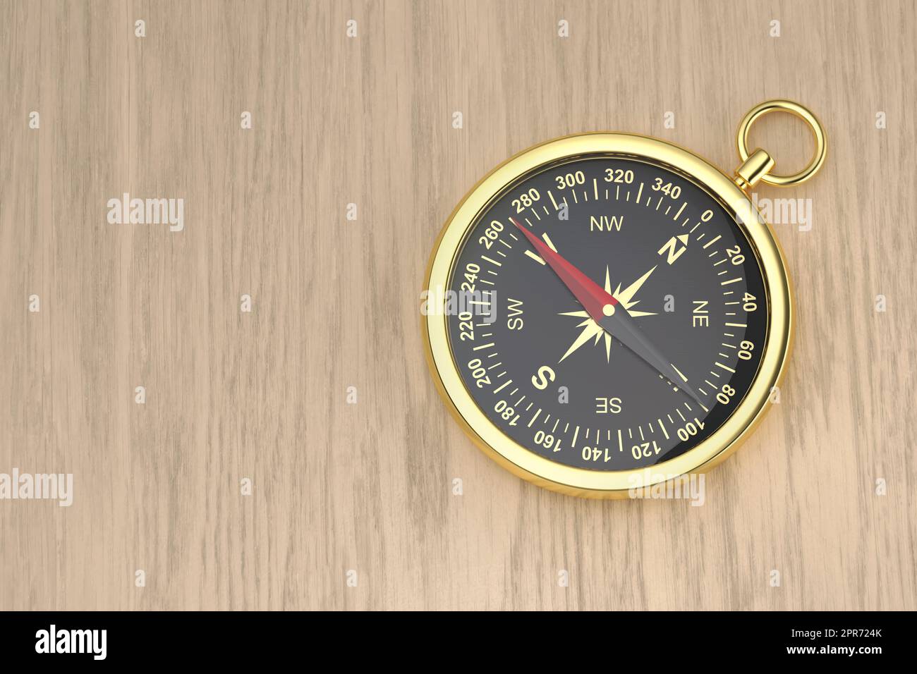 Gold compass on the wood table, top view Stock Photo - Alamy