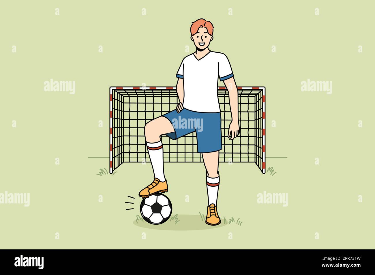 Smiling goalkeeper in uniform standing on field. Happy man player with ...