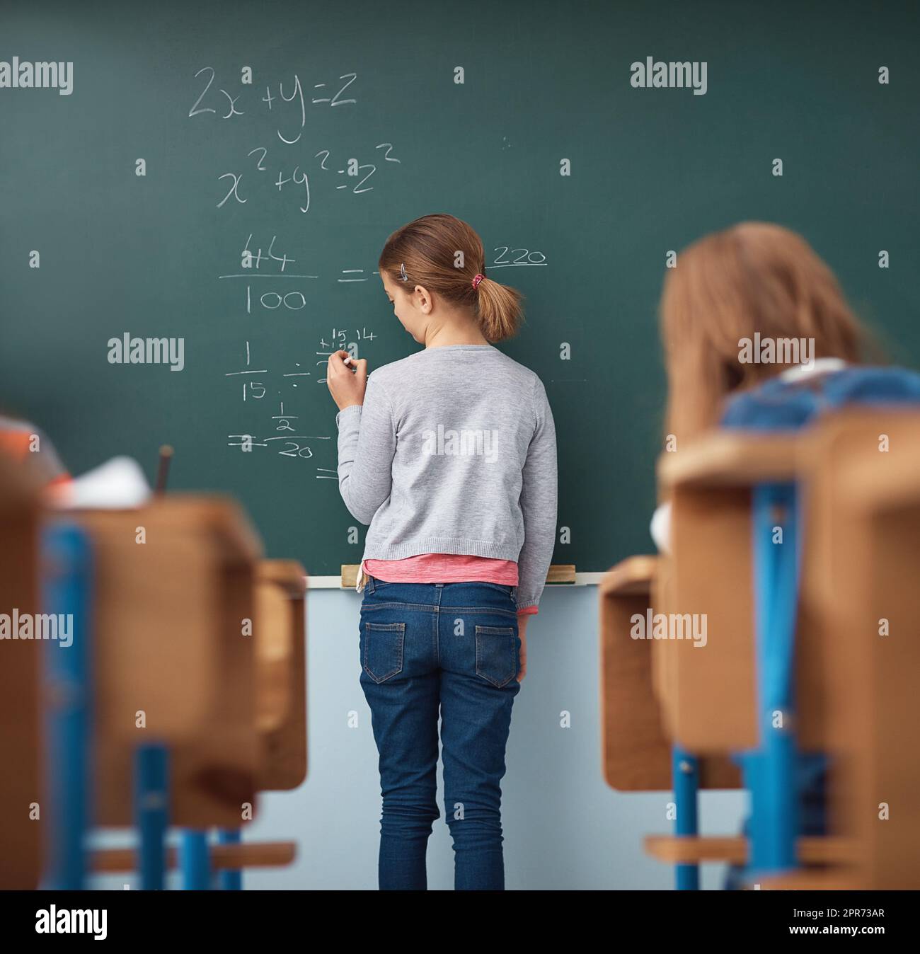 Rear view little girl standing hi-res stock photography and images - Alamy