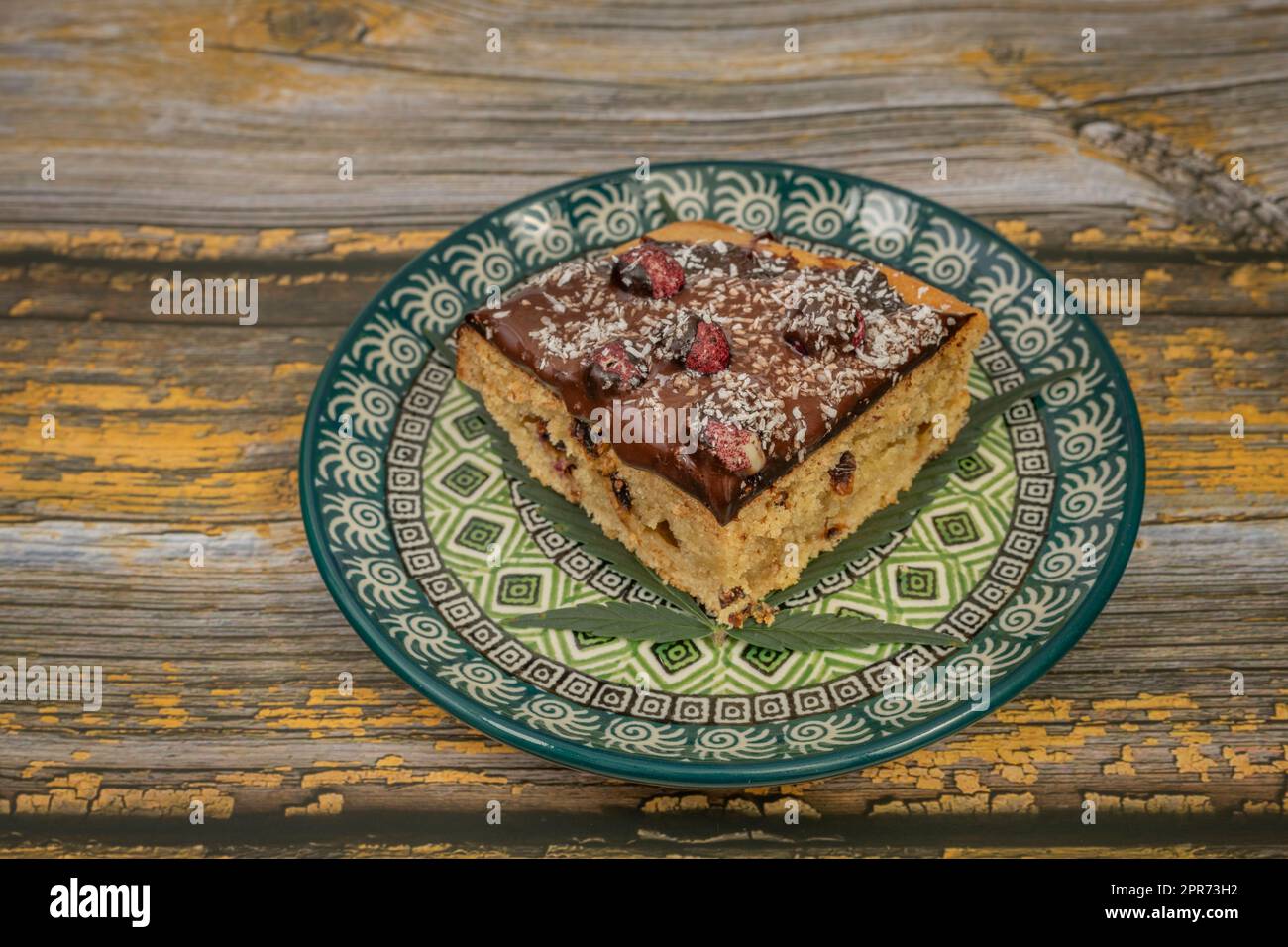 Marijuana cake with dry red currants and chocolate on arabic color ...