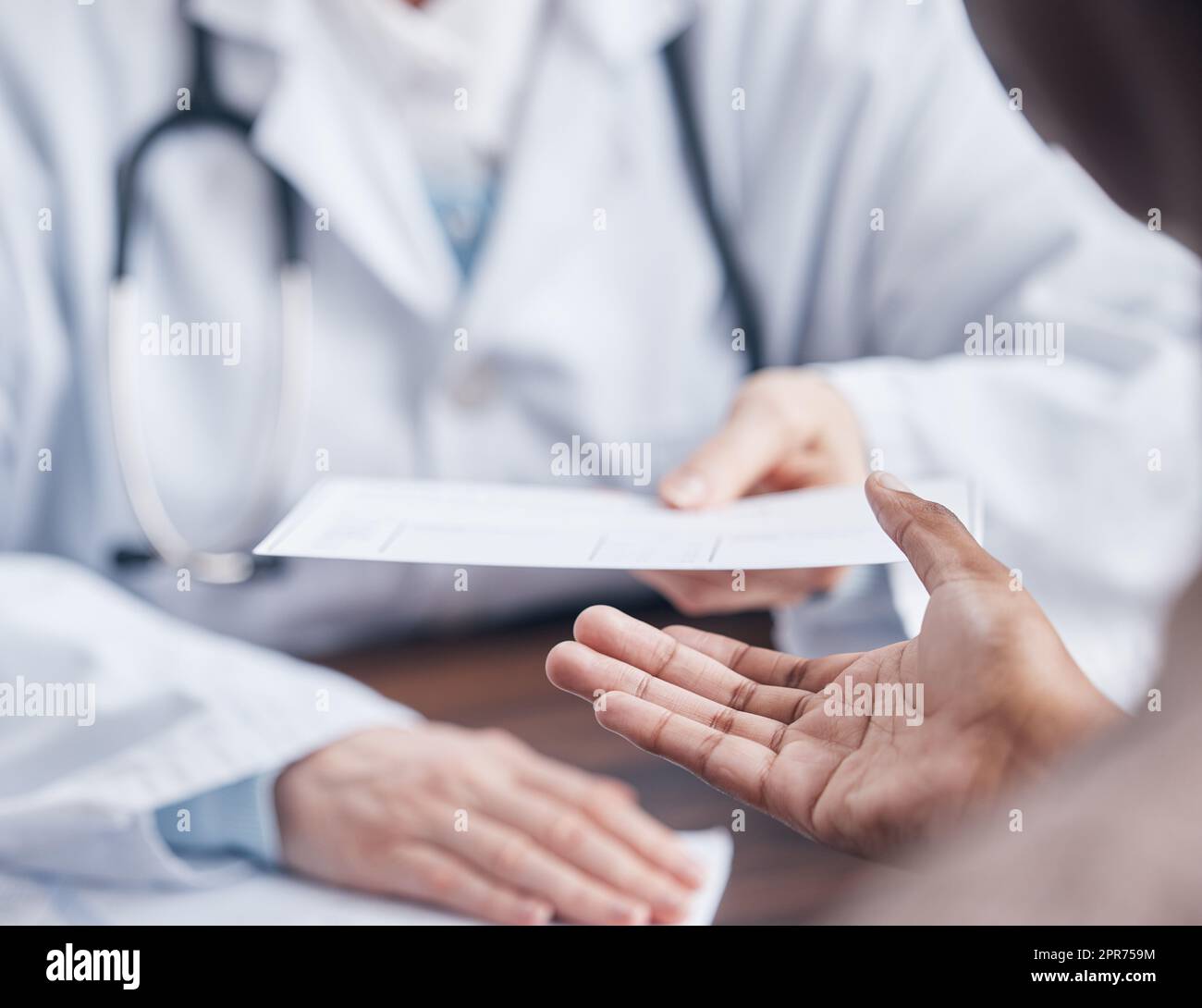 Doctor giving patient note hi-res stock photography and images - Alamy
