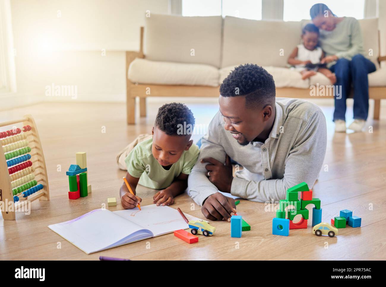 African boy sitting on floor hi-res stock photography and images - Alamy