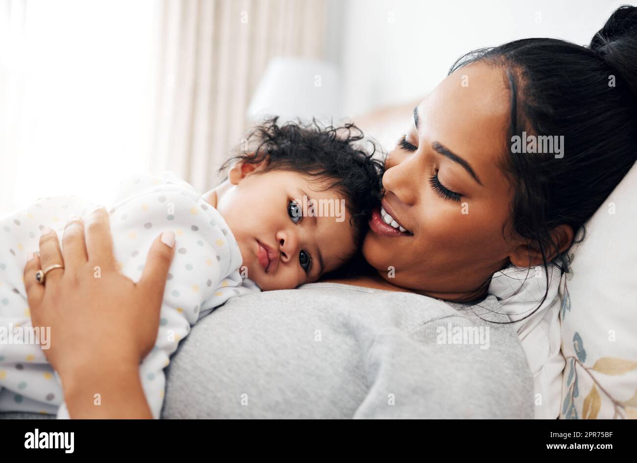 A mother cuddling her baby daughter hi-res stock photography and images ...
