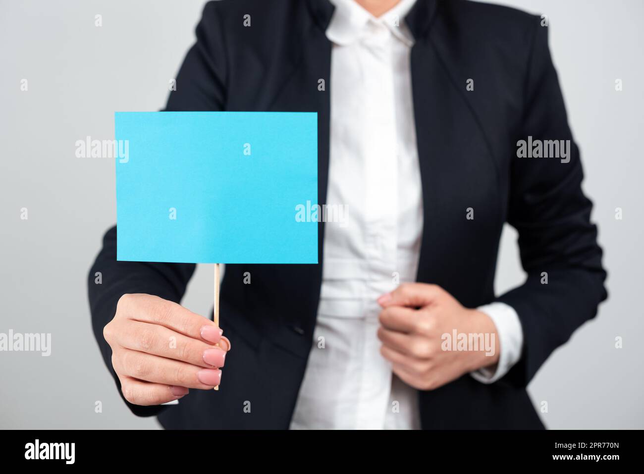 Businesswoman Holding Important Message On Paper Attached To Stick ...