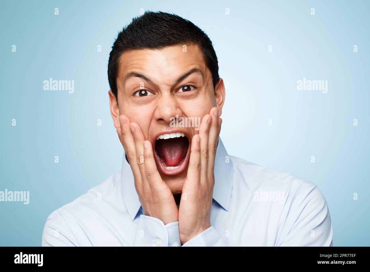 Scream until youre blue in the face. Shot of a young man screaming ...