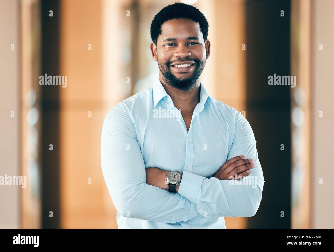 Weve got work to do. Shot of a young businessman standing with his arms ...