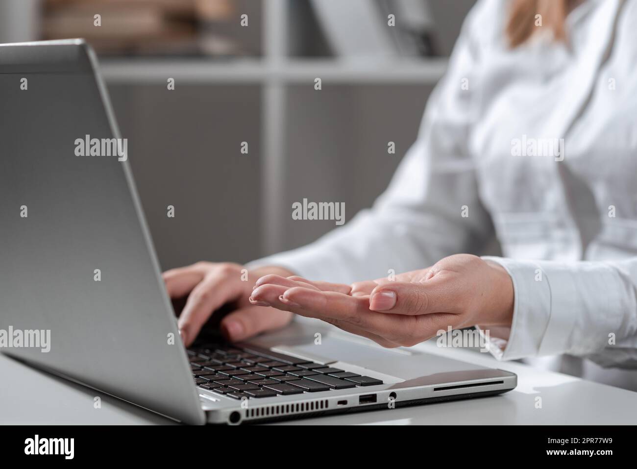 Businesswoman Typing Recent Update On Lap Top Keyboard On Desk And ...