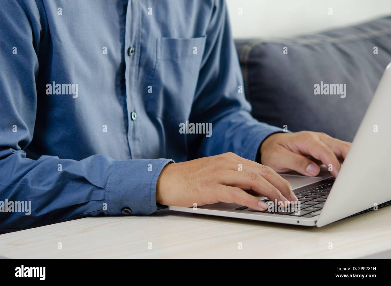 Businessman hand typing keyboard on laptop computer. Close up ...
