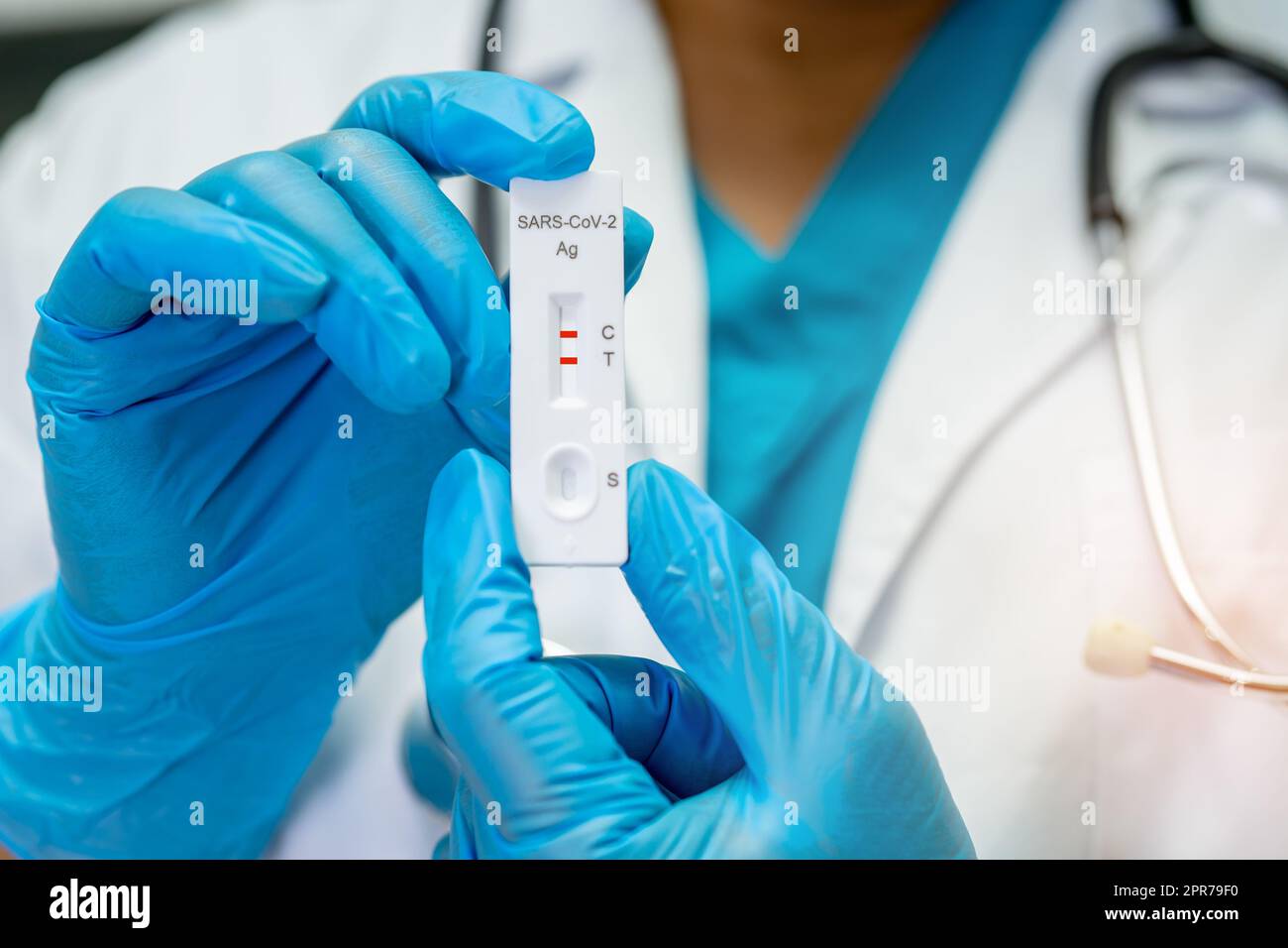 Asian doctor in PPE suit show positive test result with Saliva Antigen ...