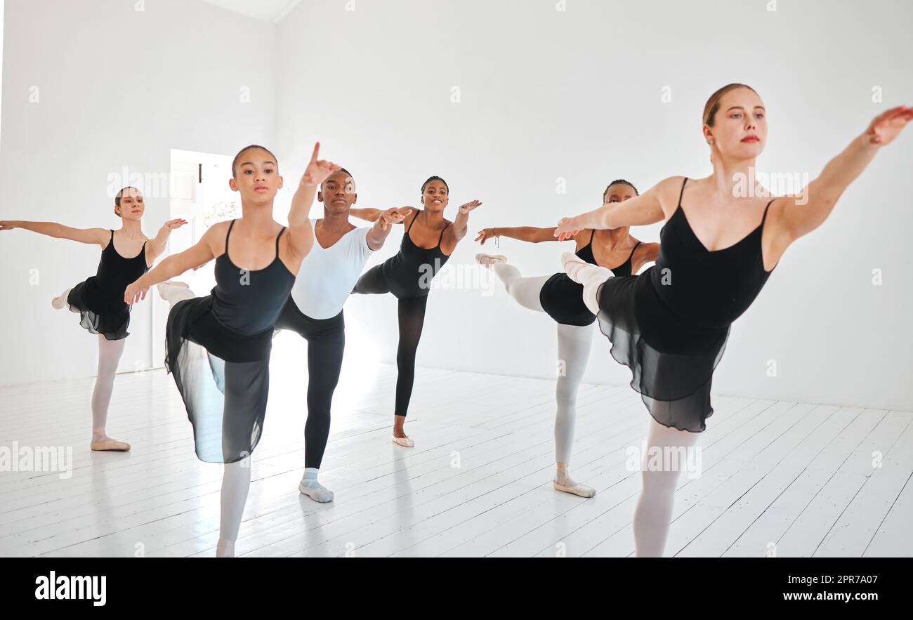 Ballet is the only way. a group of young ballet dancers practicing ...