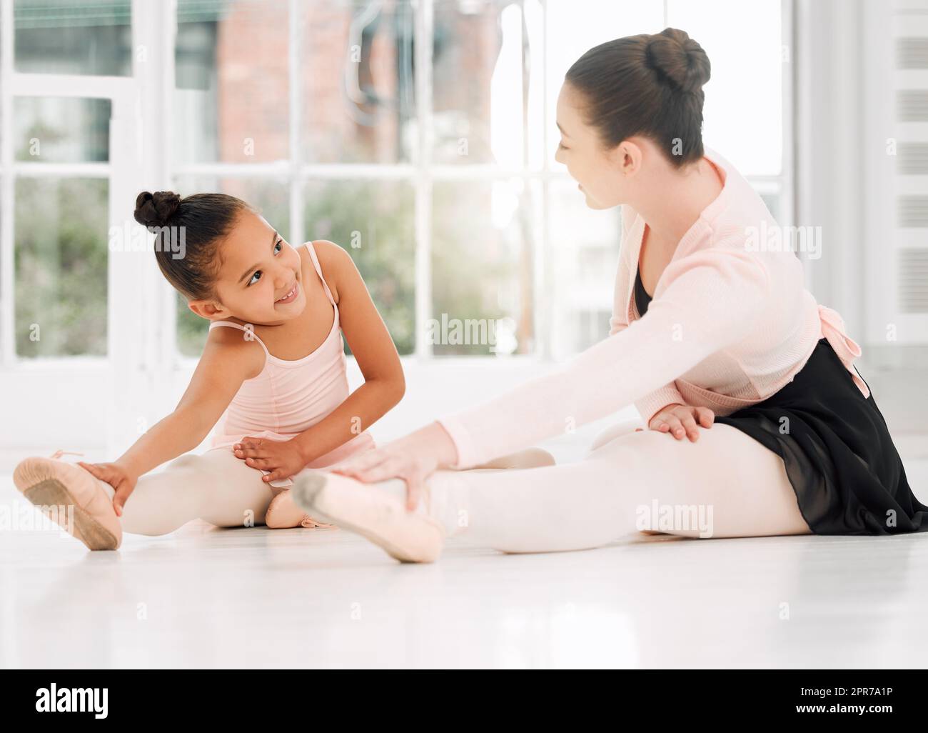 Young woman smiling with ballet shoes hi-res stock photography and ...