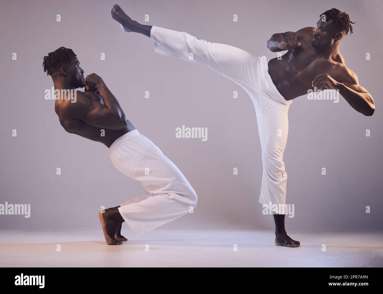 You are stronger than you think. two men fighting against a grey ...