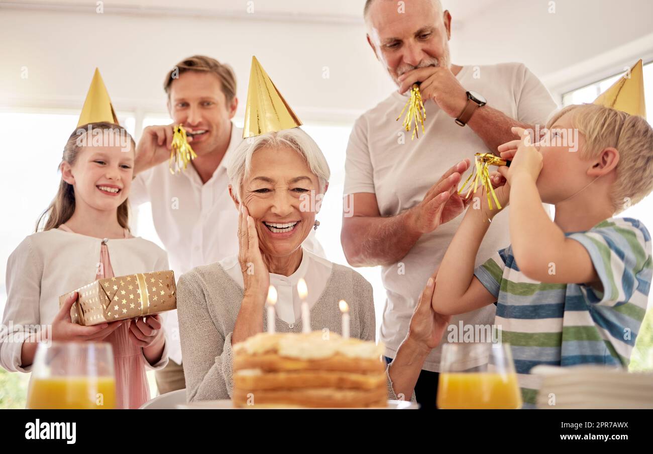 Grandma wearing birthday hat hi-res stock photography and images - Alamy