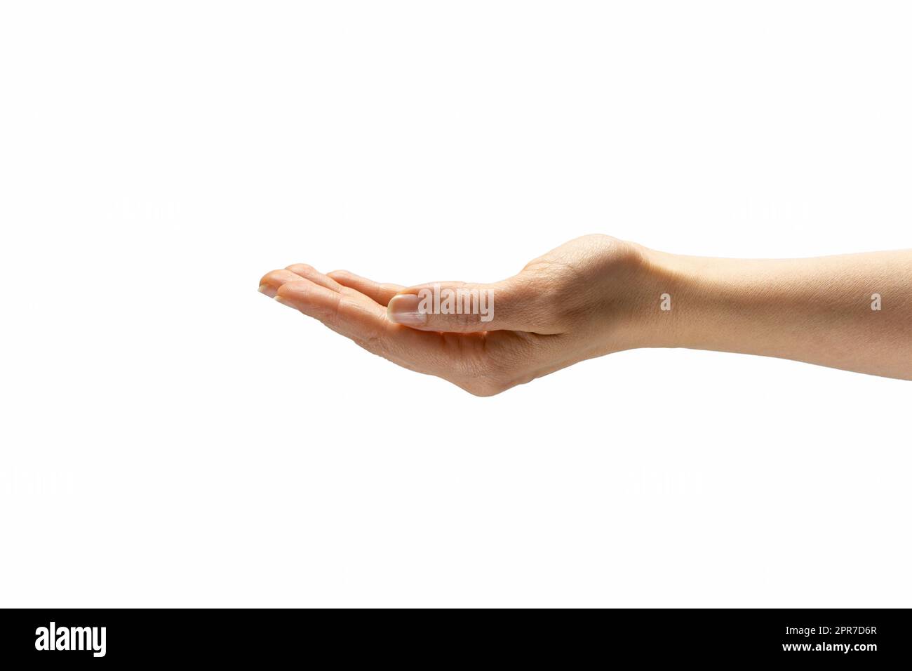 A woman's hand shows a gesture of an invisible object on a white ...
