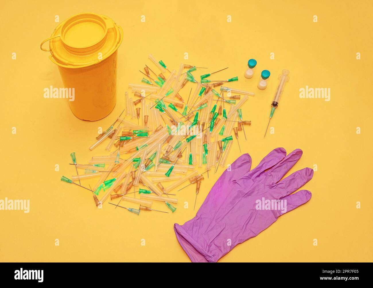 Pile of medical waste needles with glove Stock Photo - Alamy