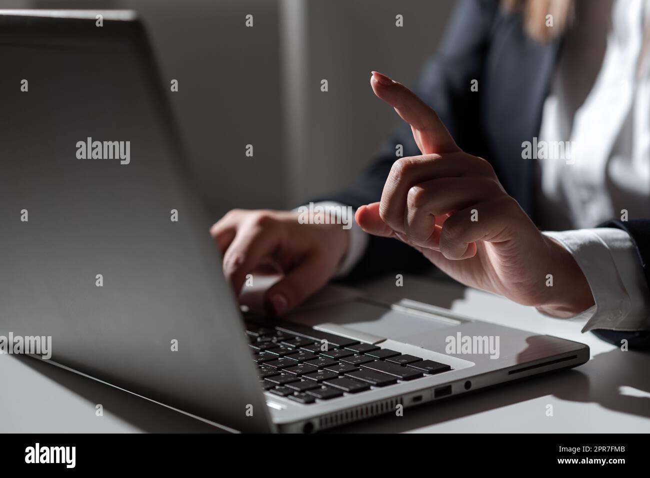 Businesswoman Typing Recent Updates On Lap Top Keyboard On Desk With ...