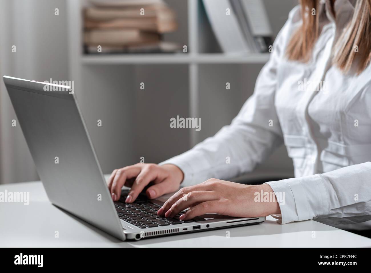 Businesswoman Typing Recent Updates On Lap Top Keyboard On Desk. Woman ...