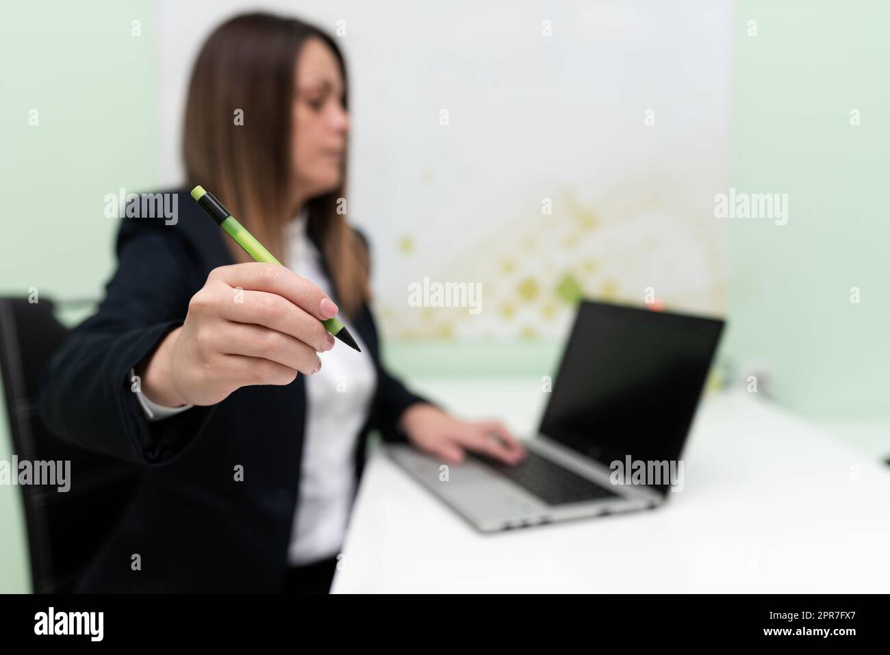 Businesswoman Typing Recent Updates On Lap Top Keyboard On Desk And ...