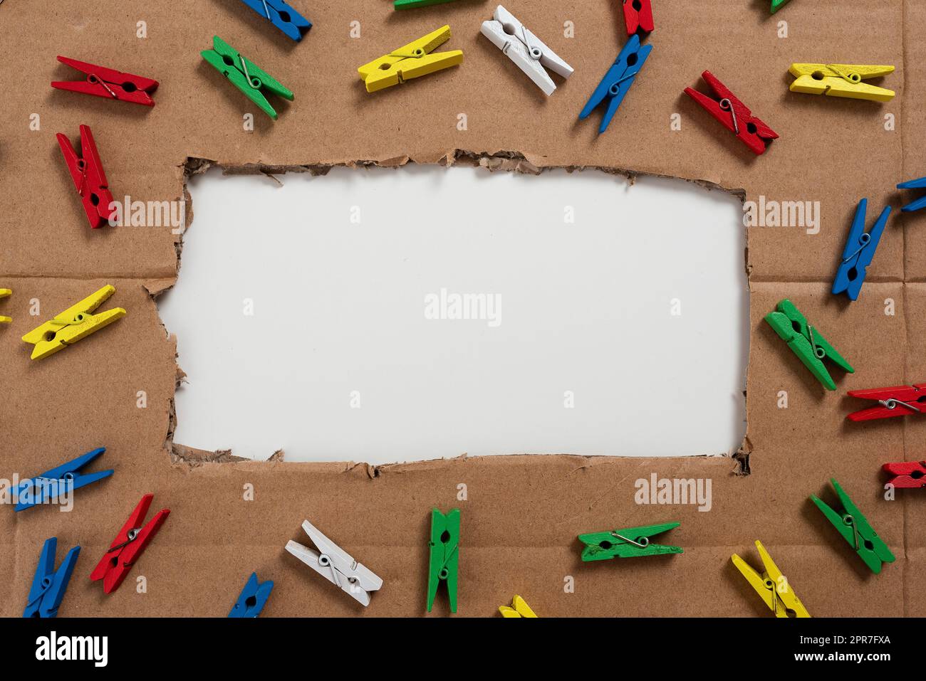 Important Informations Written Under Ripped Cardboard With Colored Pegs ...