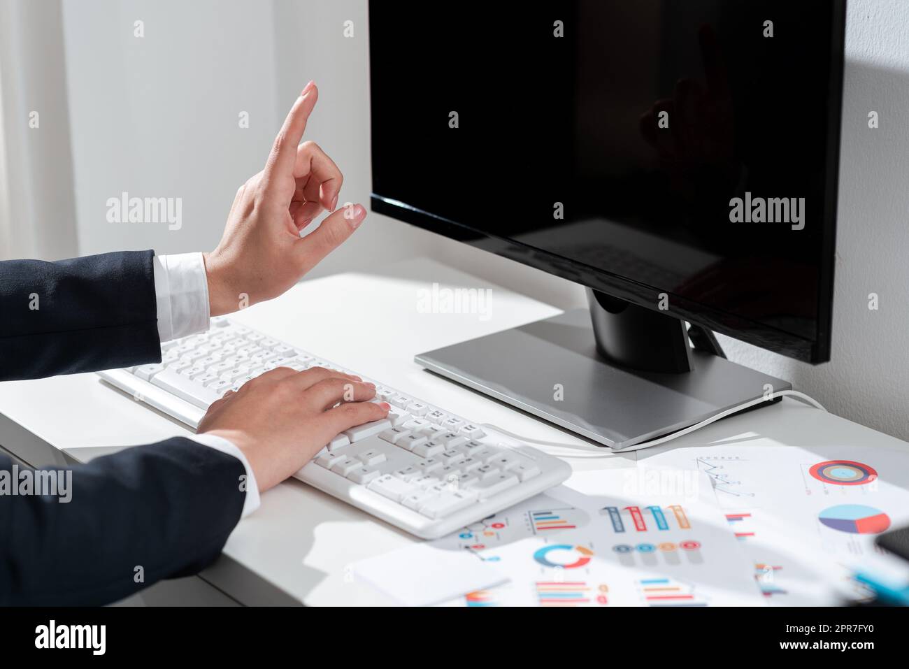 Businesswoman Typing Recent Updates On Lap Top Keyboard On Desk And ...