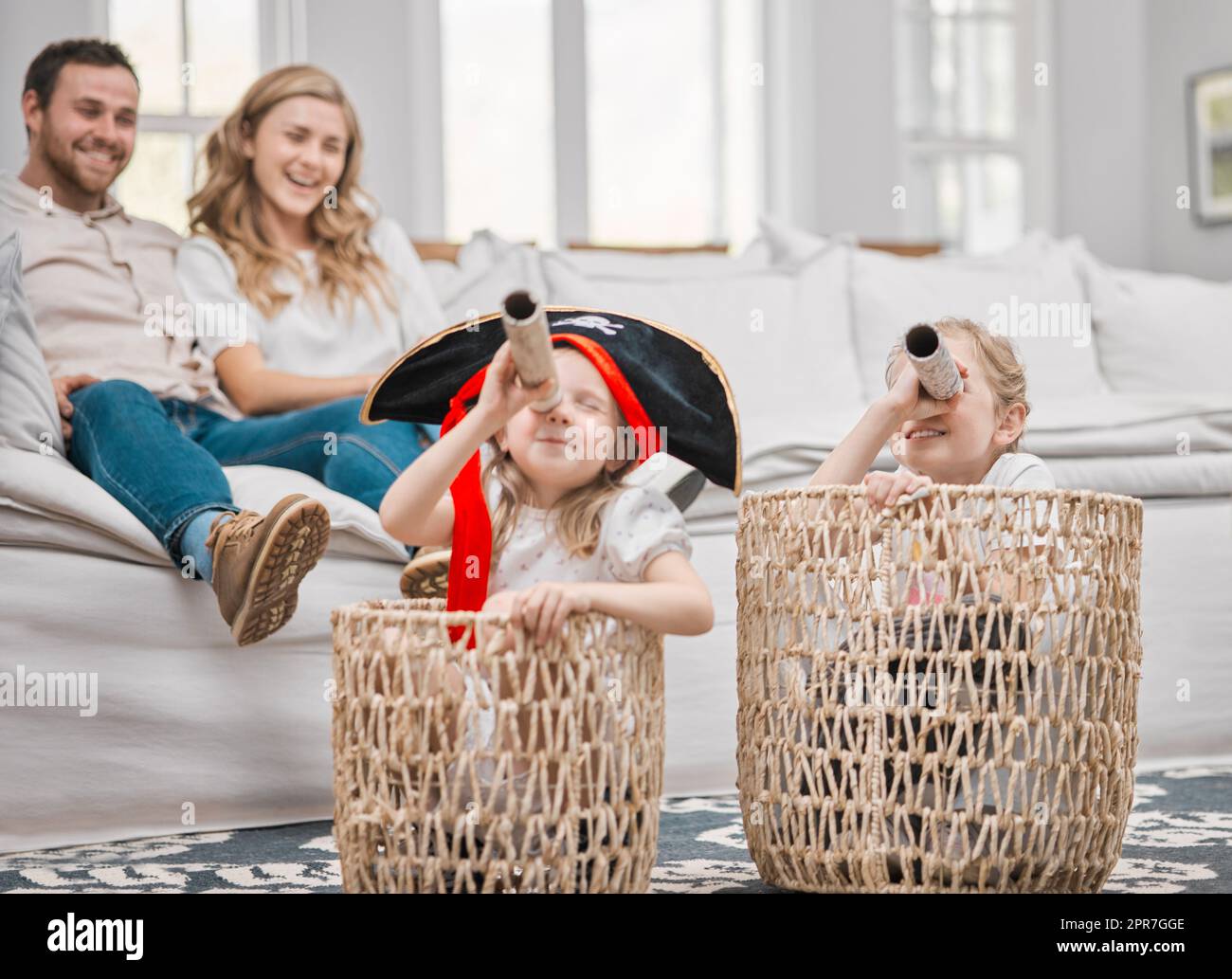 Shot of children playing while their parents watch in the lounge Stock ...