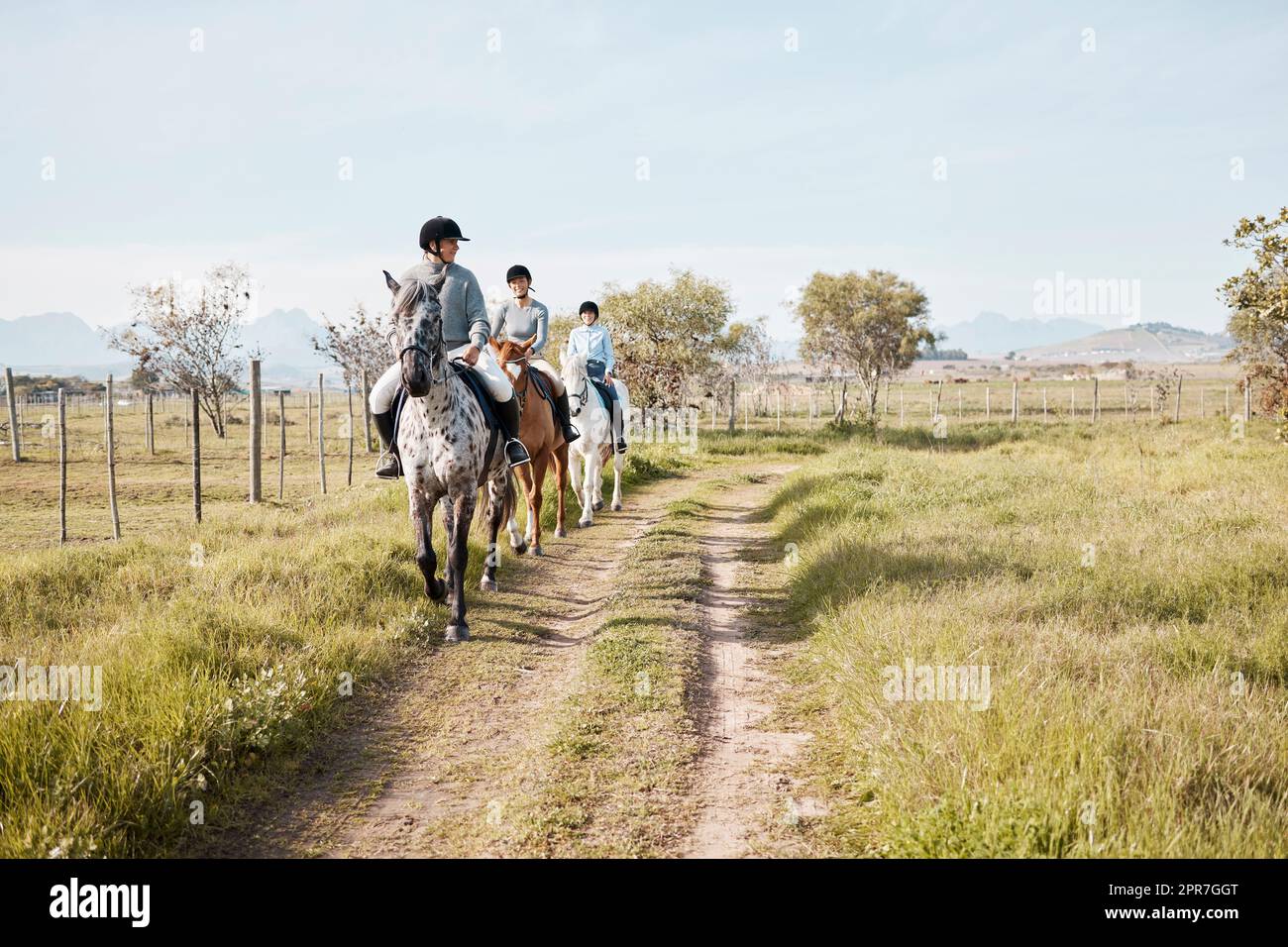 Three women horse riding on hi-res stock photography and images - Alamy