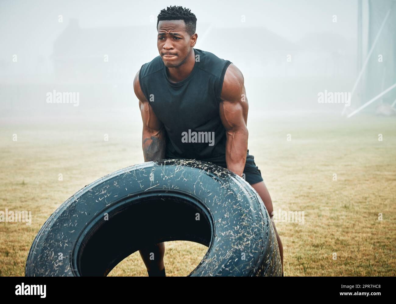 Man holding tyre weight hi-res stock photography and images - Alamy