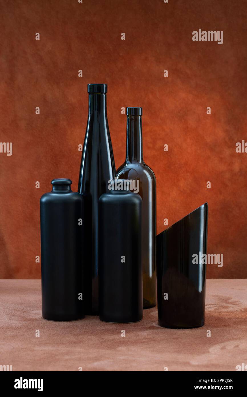 Still life with glass objects on a brown background Stock Photo - Alamy