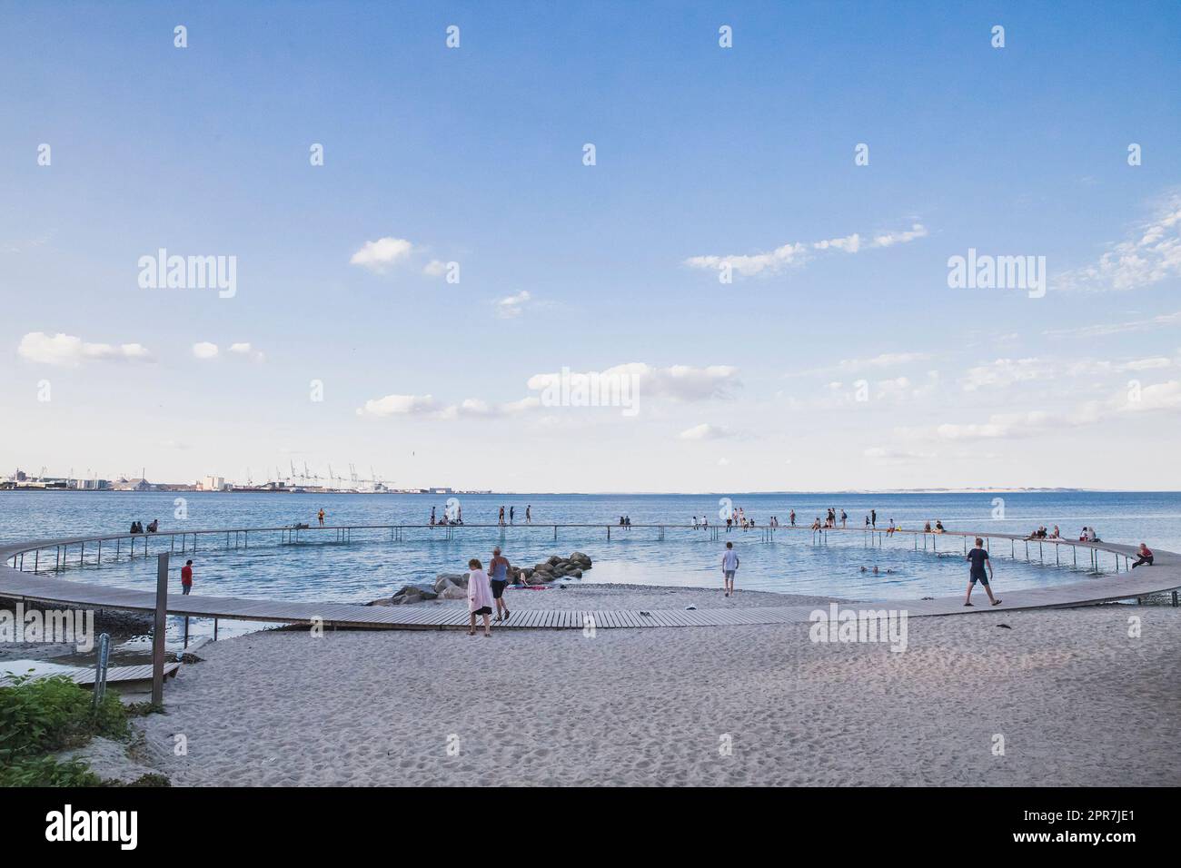 people rest on a round pier in Aarhus Denmark Stock Photo - Alamy