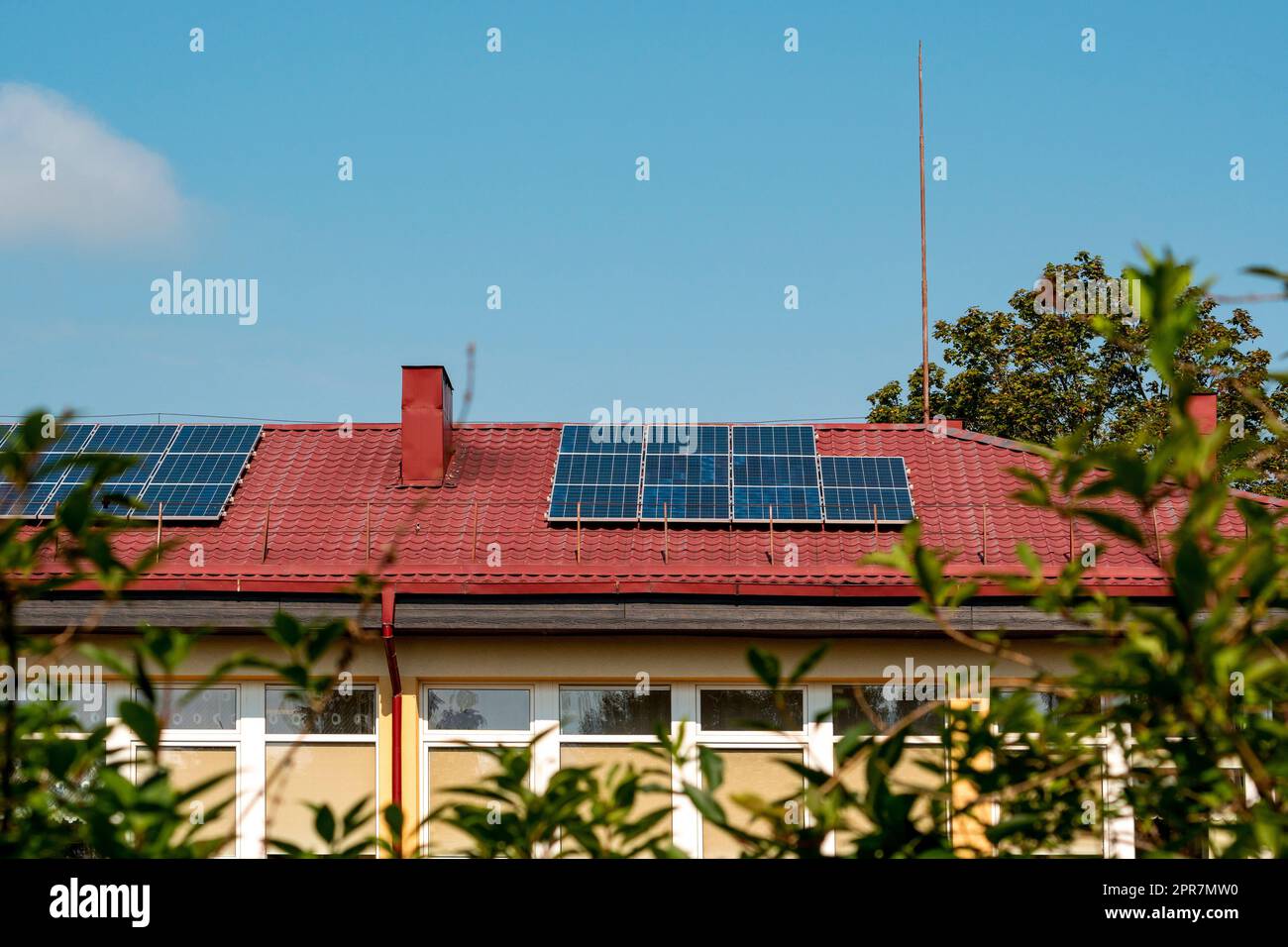Photovoltaic or solar panels on a red roof Stock Photo - Alamy