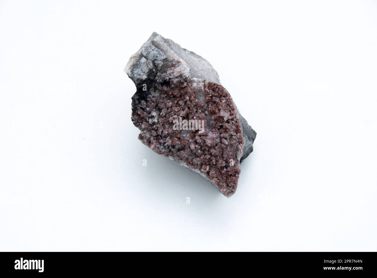 calcite on a rock over white background Stock Photo - Alamy