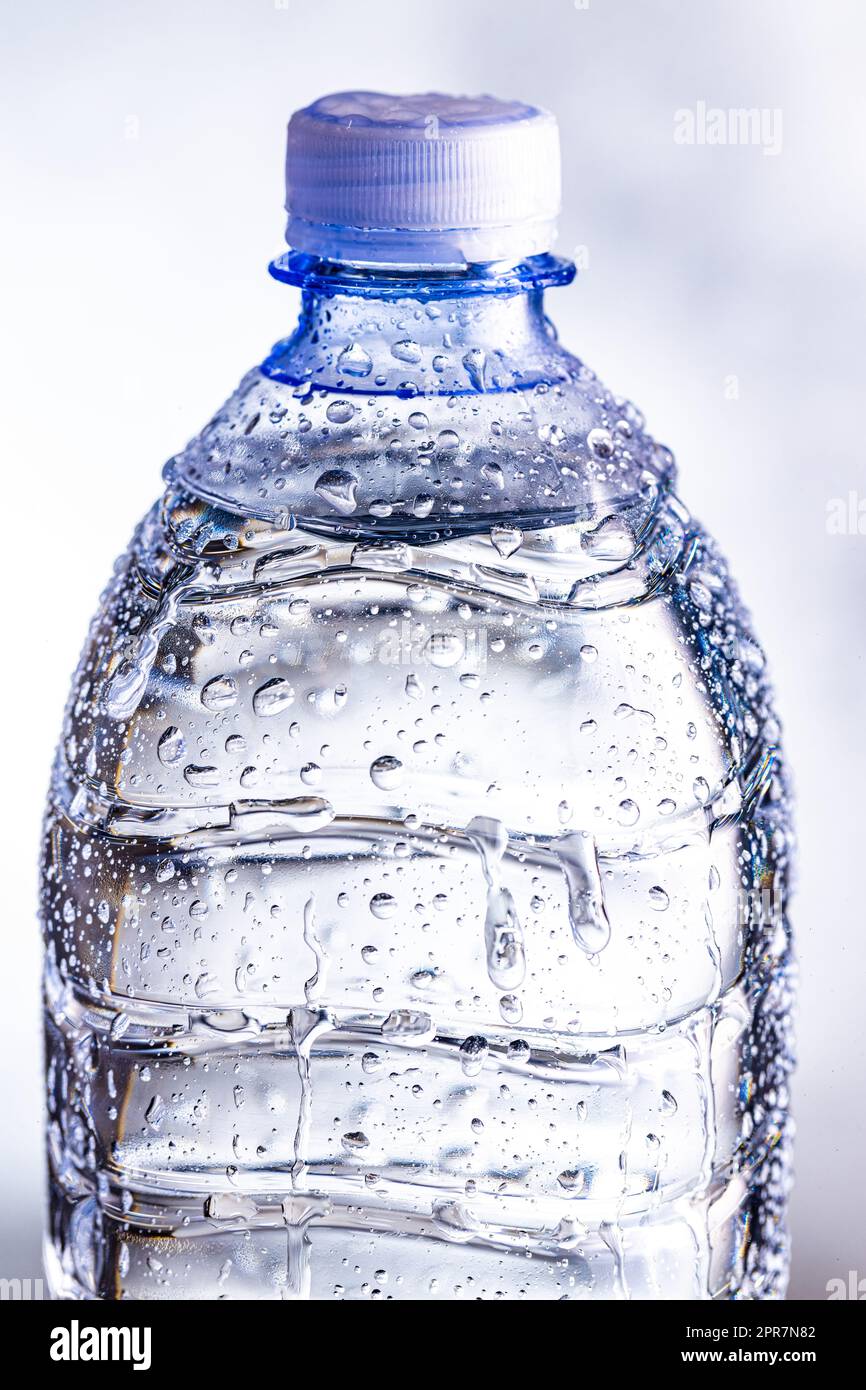 Detail of plastic cold bottle of water with water drops Stock Photo - Alamy