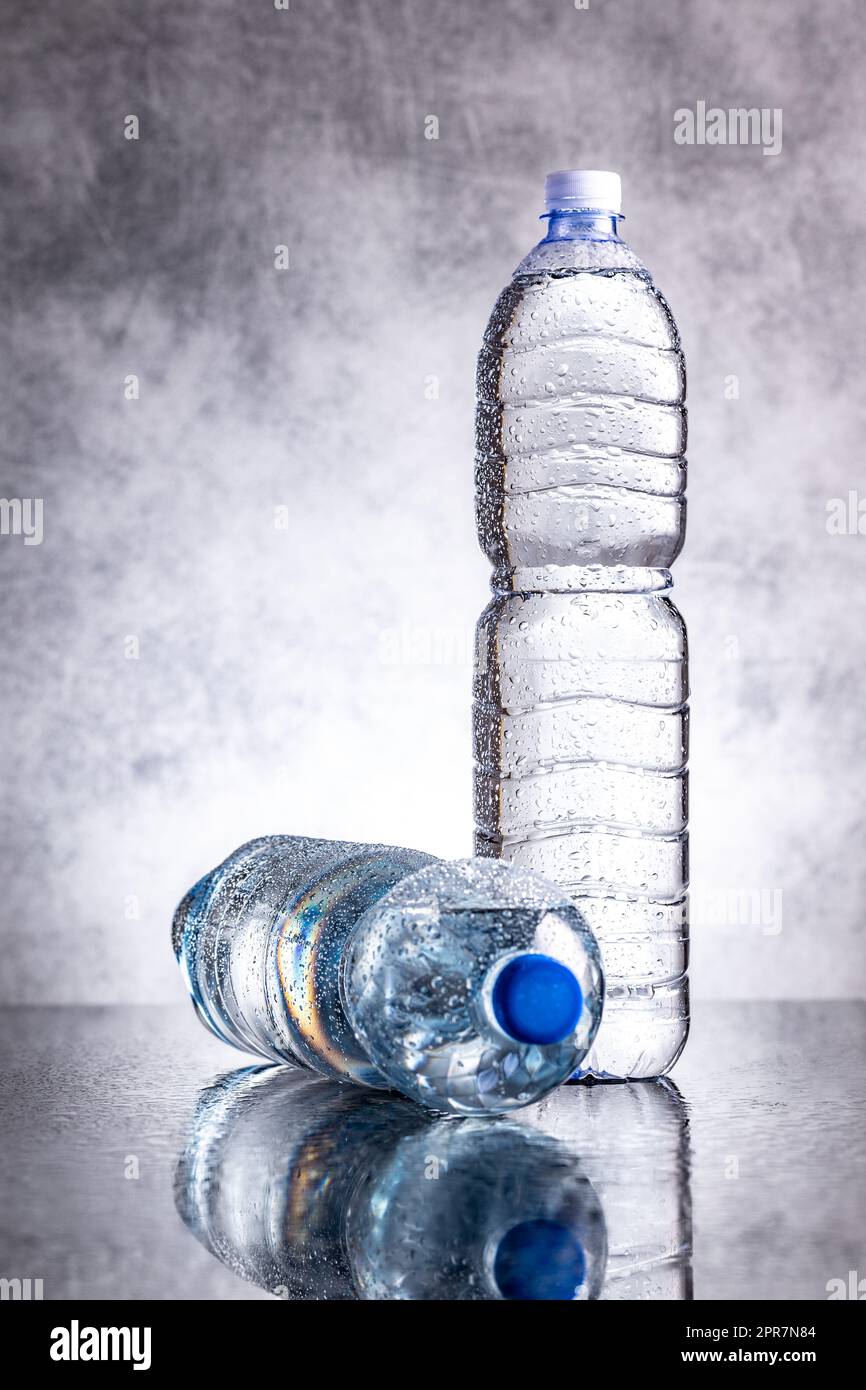Two plastic cold bottles of water with water drops Stock Photo - Alamy