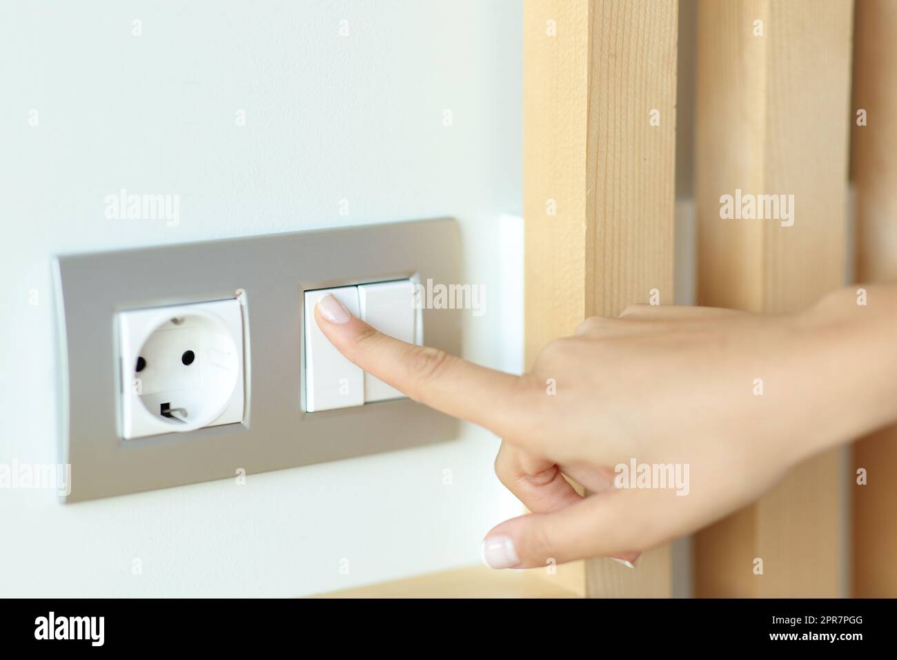 Woman switching on off electric hi-res stock photography and images - Alamy