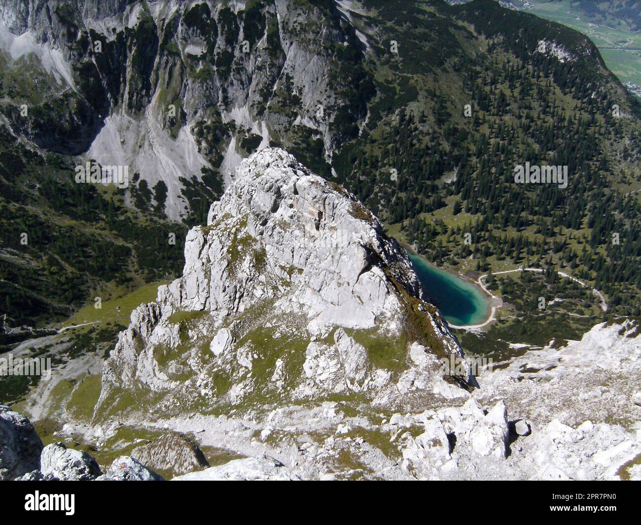 Via ferrata at high mountain lake Seebensee, Tajakopf mountain, Tyrol ...