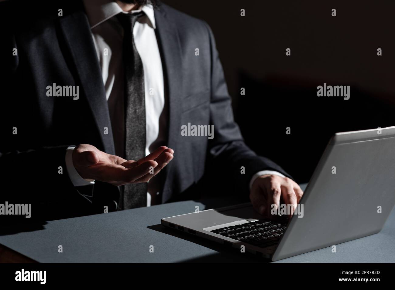 Businessman Typing Important Concept Into Lap Top And Showing New Idea ...