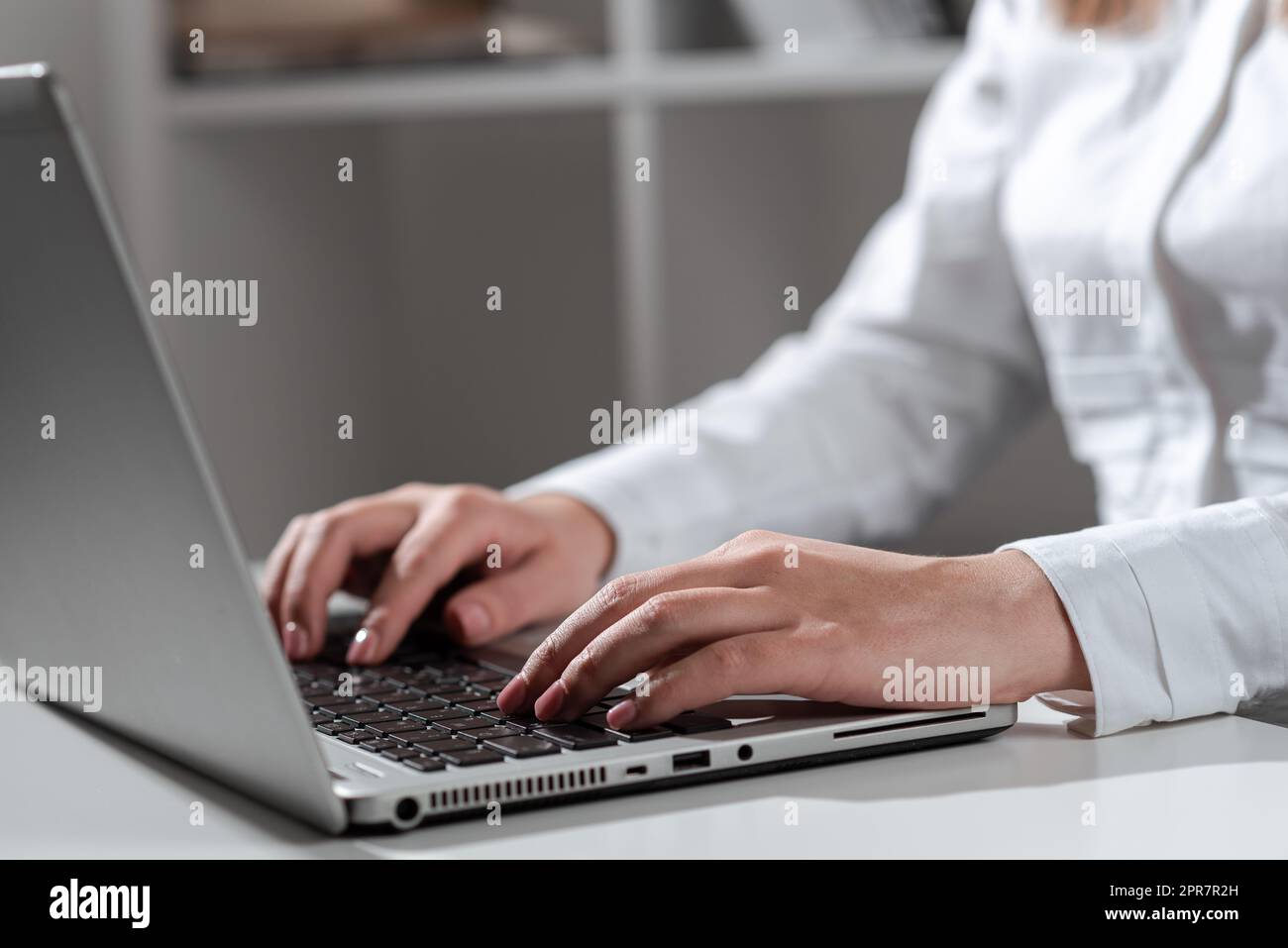 Businesswoman Typing Recent Updates On Lap Top Keyboard On Desk. Woman ...