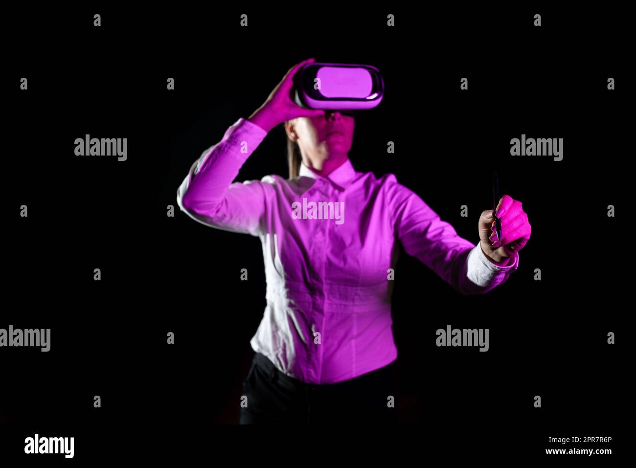 Female Manager Wearing Virtual Reality Headset Holding Pet While Taking ...