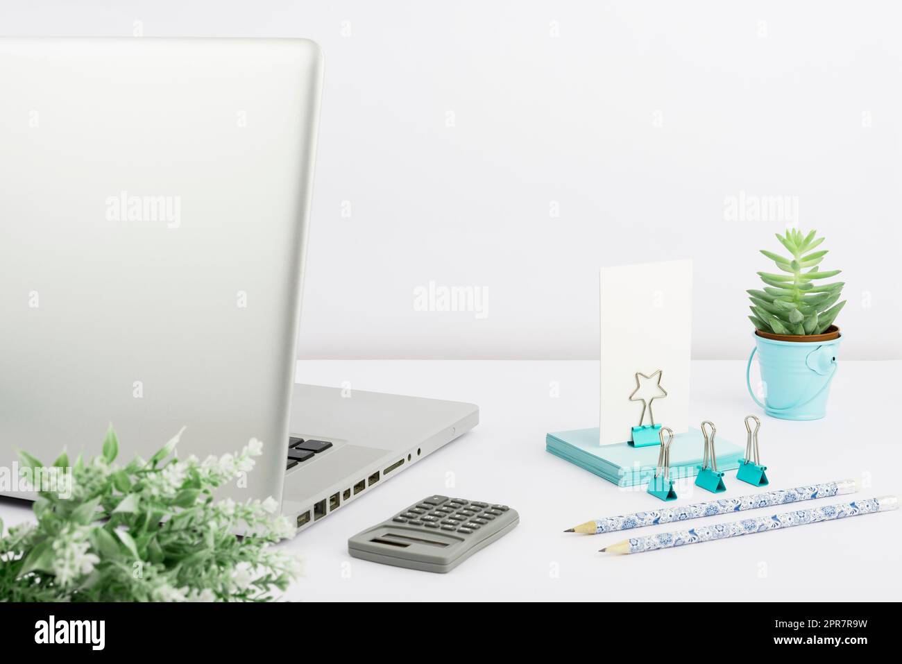 Lap Top, Pencils, Calculator, Paperclips, Flowers And Sticky Notes ...