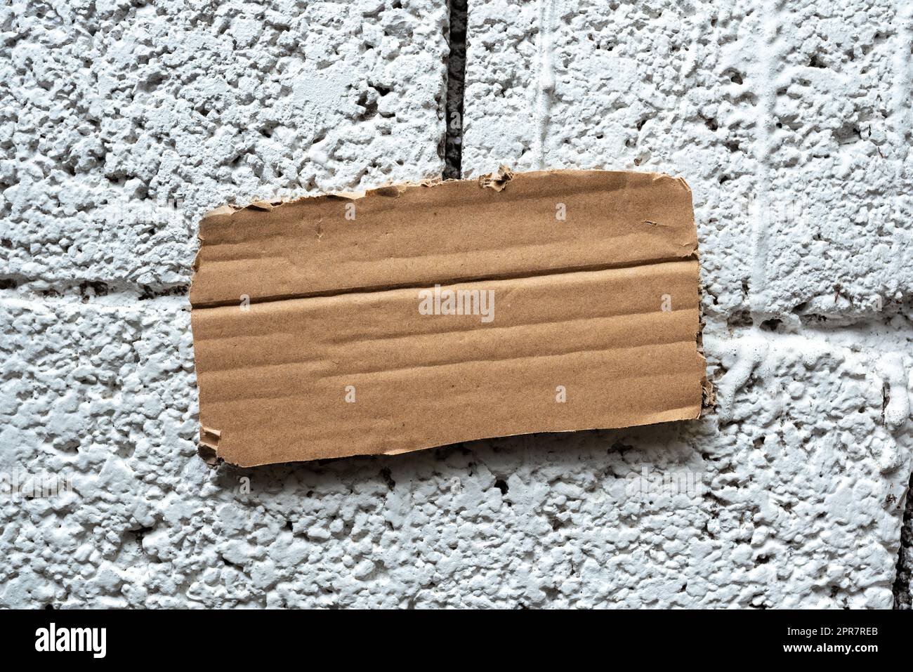 Piece Of Cardboard On Floor With Important Information Written In ...