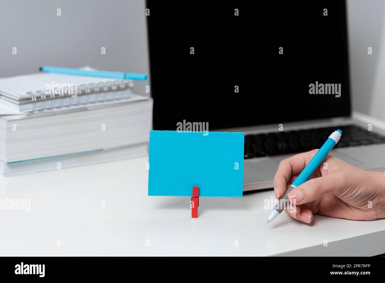Businesswoman Holding Pen On Desk With Lap Top, Books And Note With ...
