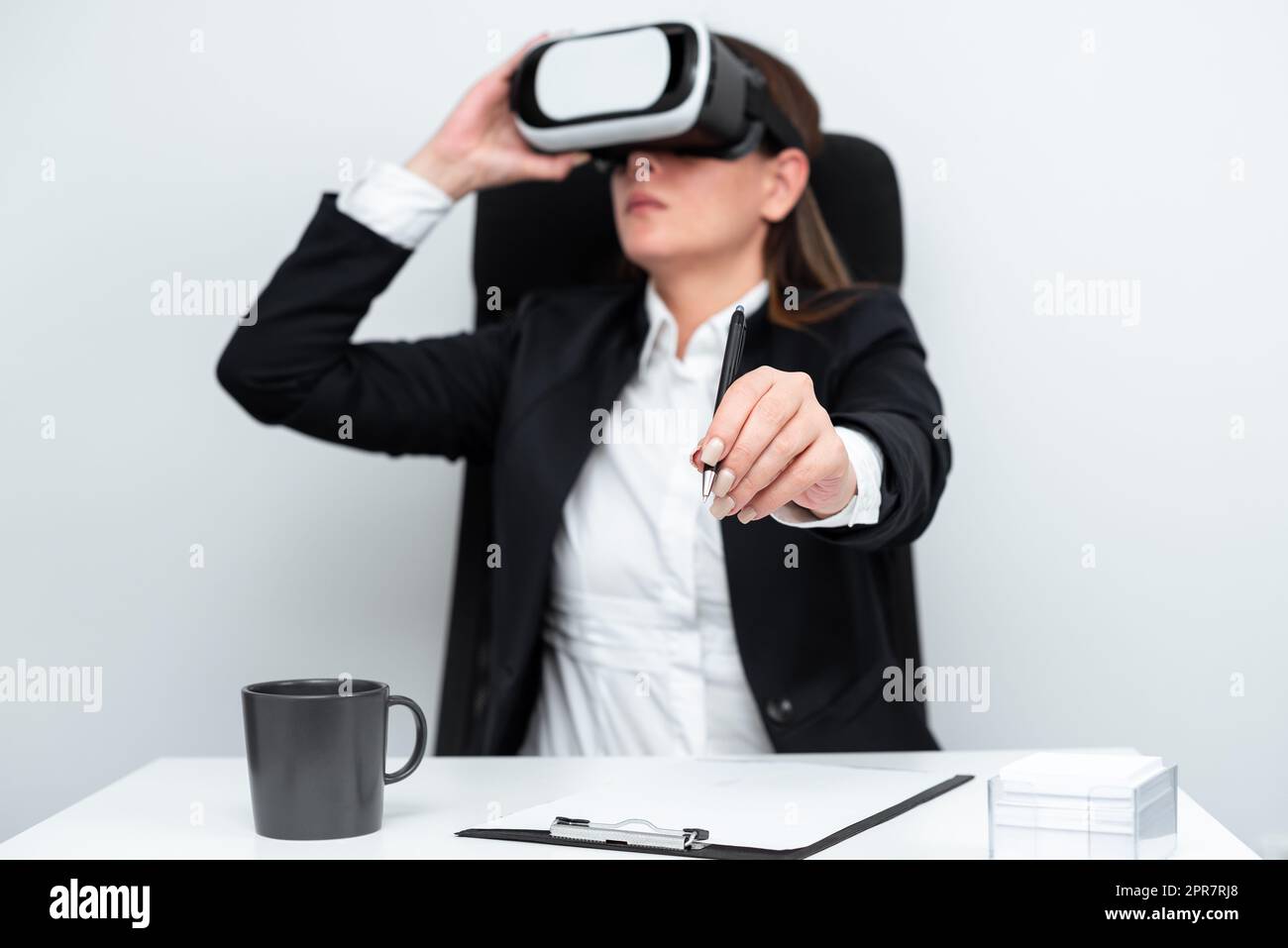 Female Executive Holding Pen And Learning Professional Skill Through ...