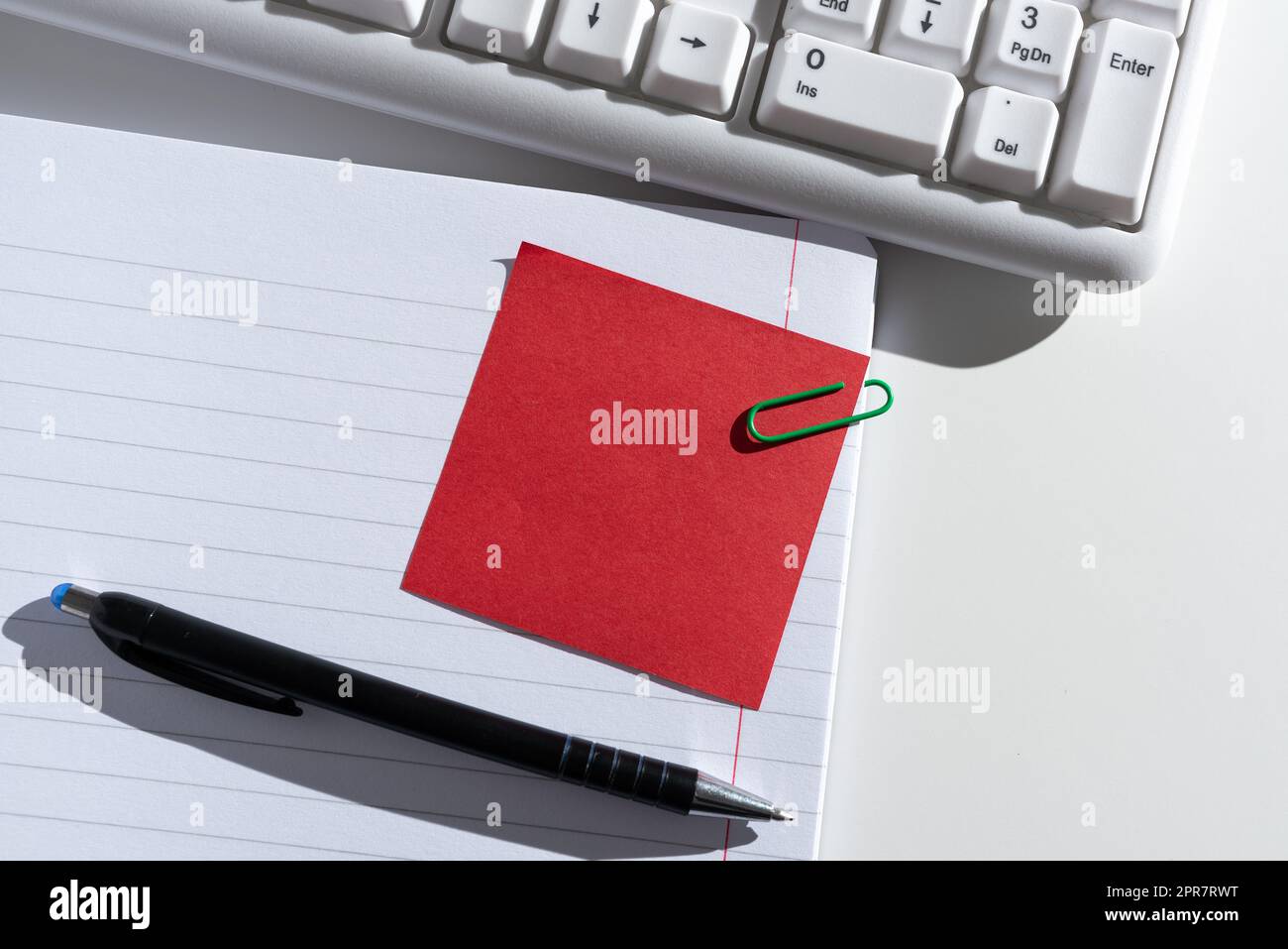 Sticky Note With Important Message Clipped On Opened Notebook On Desk ...