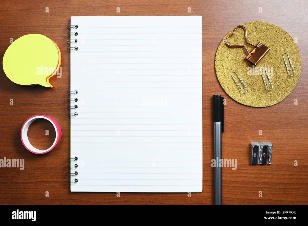 Notebook With Important Message On Desk With Pen, Sharpener, Notes ...