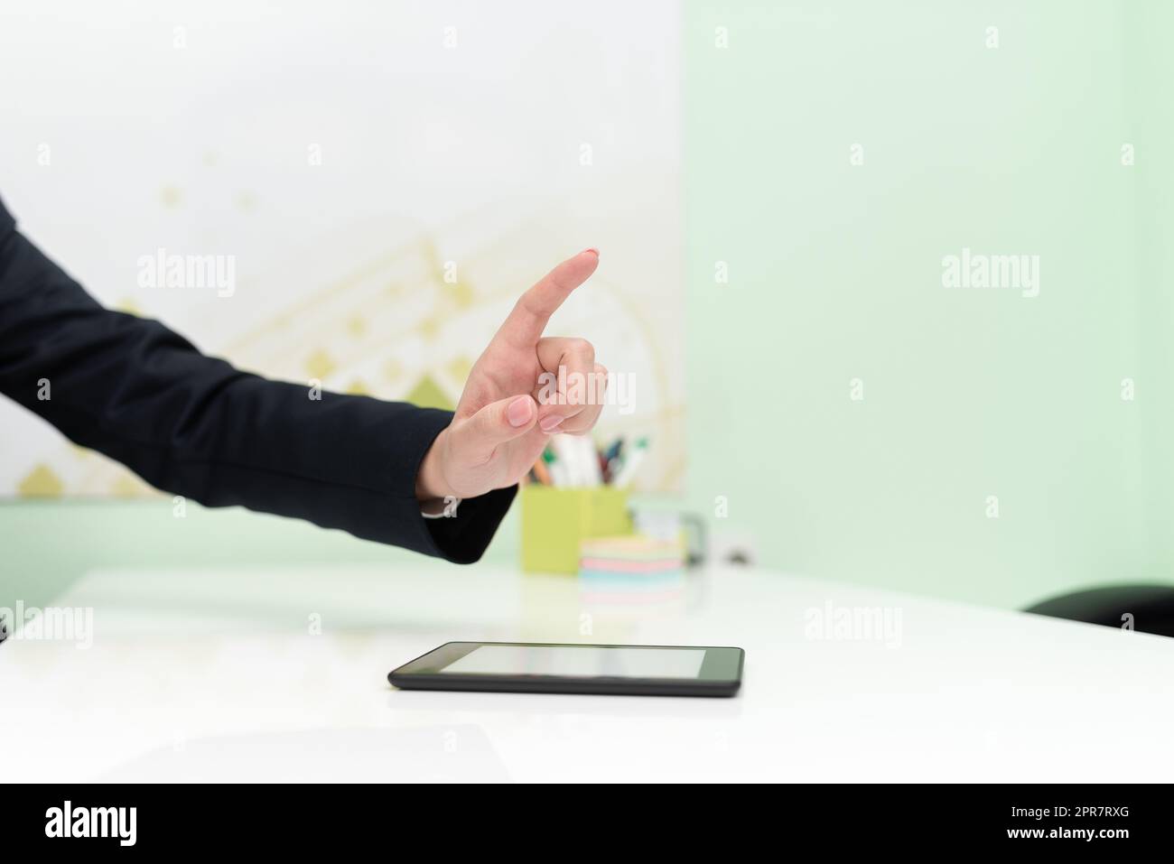 Businesswoman With Tablet On Desk Presenting New Ideas With One Finger ...