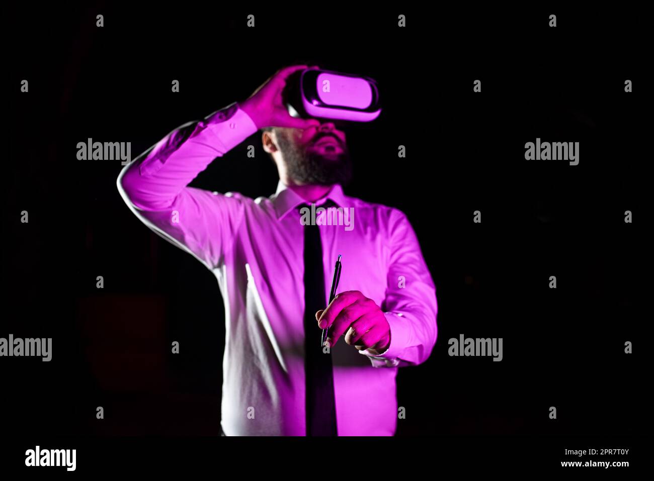 Businessman Wearing Headset Holding Pen While Taking Professional ...